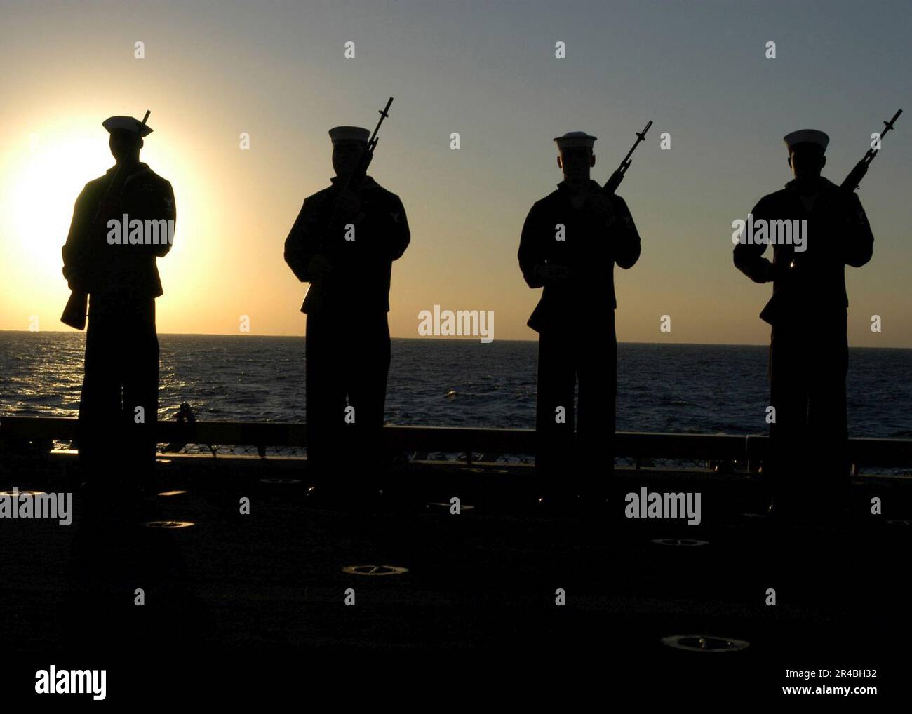 US Navy The firing detail stands by to render a 21-gun salute during a ...