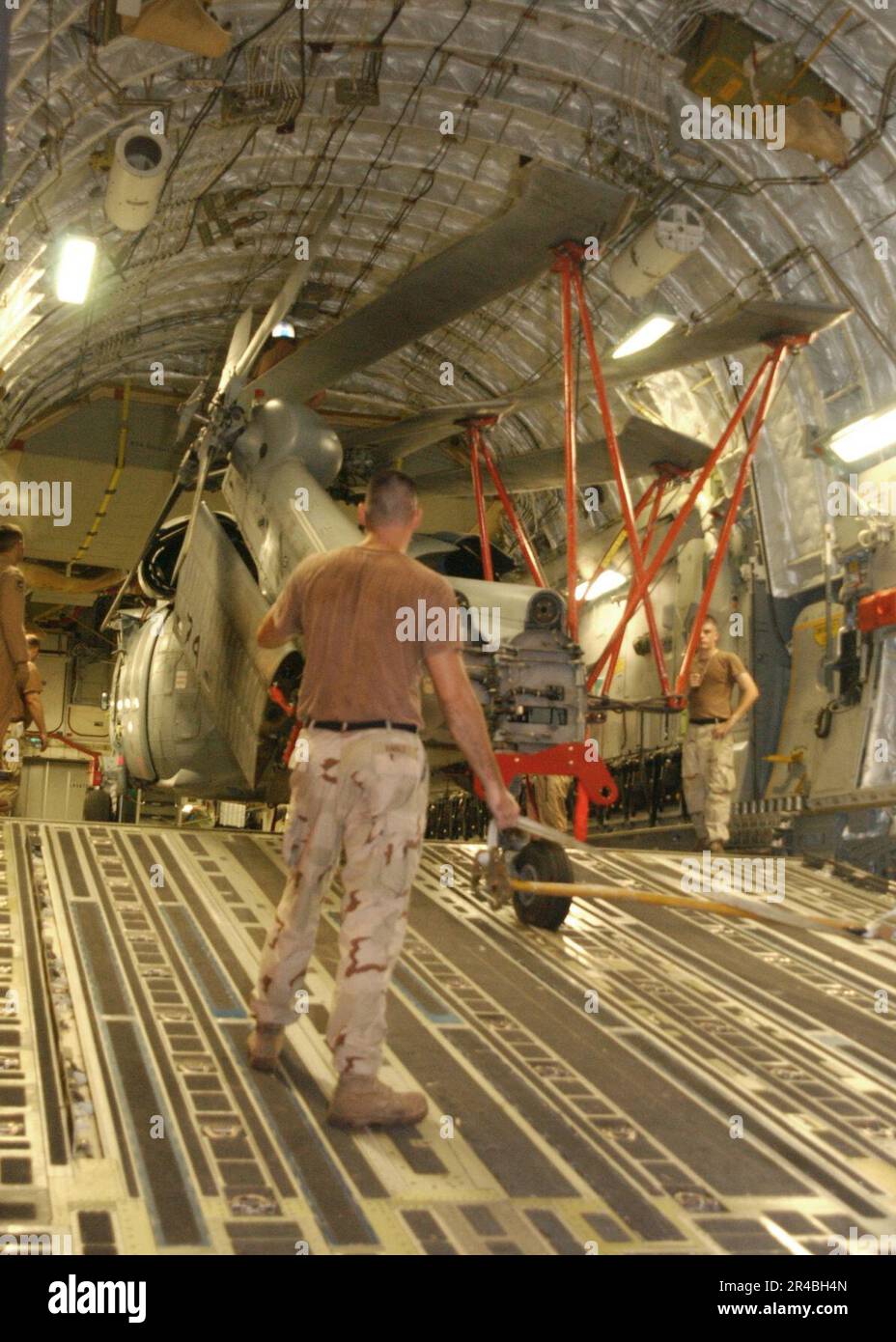 US Navy U.S. Navy helicopter loaded onto transport aircraft bound for ...