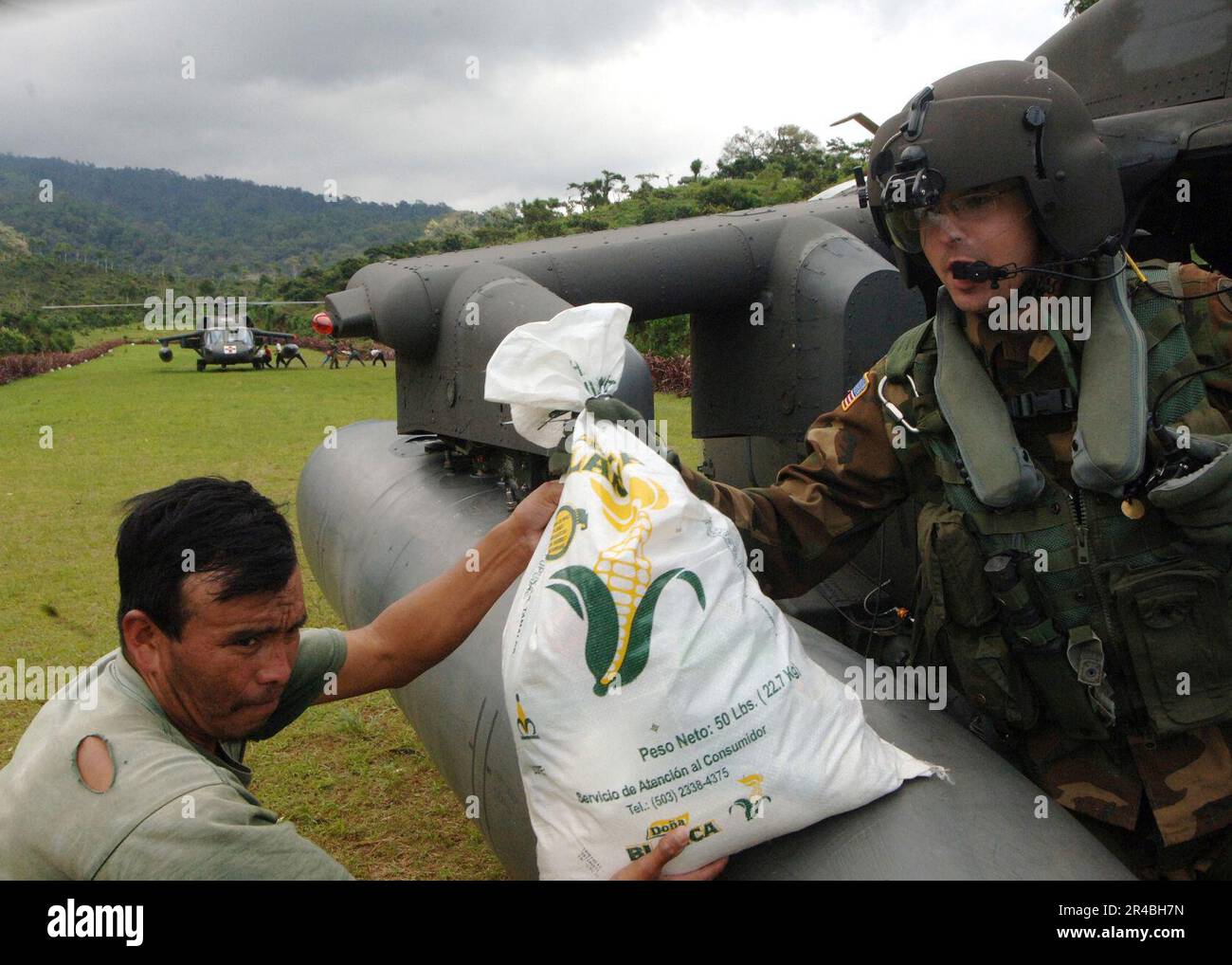 US Navy U.S. Army Specialist helps unload food, water, and medicine ...
