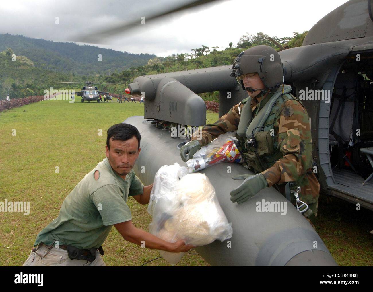 US Navy U.S. Army Specialist helps unload food, water, and medicine ...