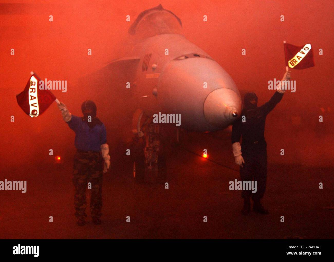 US Navy Two Sailors simulate a class Bravo Fire during a general ...