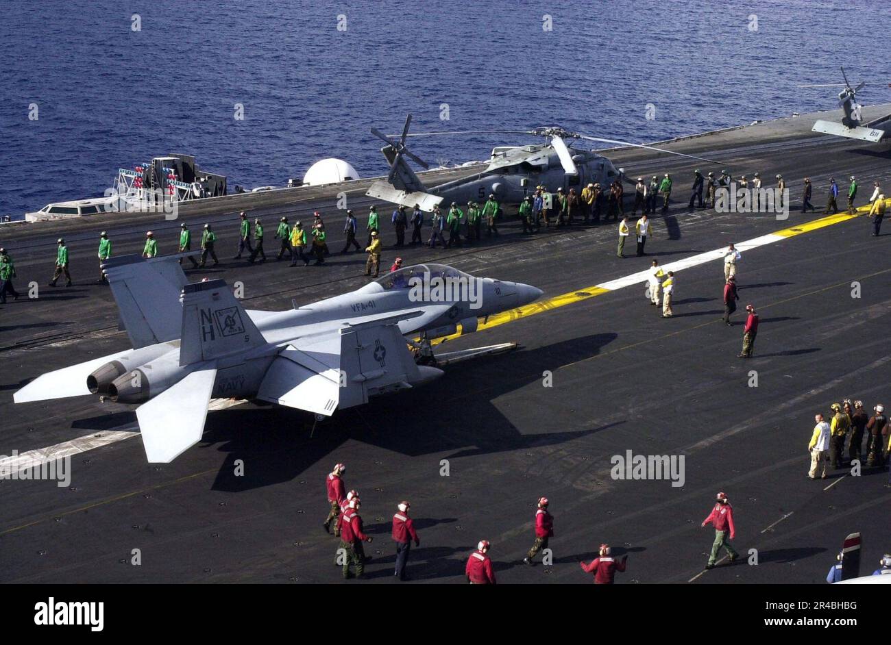 US Navy Air Department and squadron personnel conduct a flight deck ...