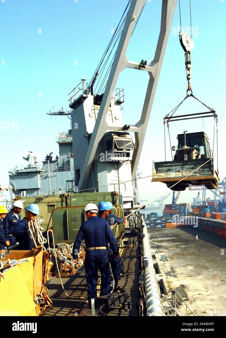 US Navy The crew aboard the dock landing ship USS Pearl Harbor (LSD 52) unloads a bulldozer from ...