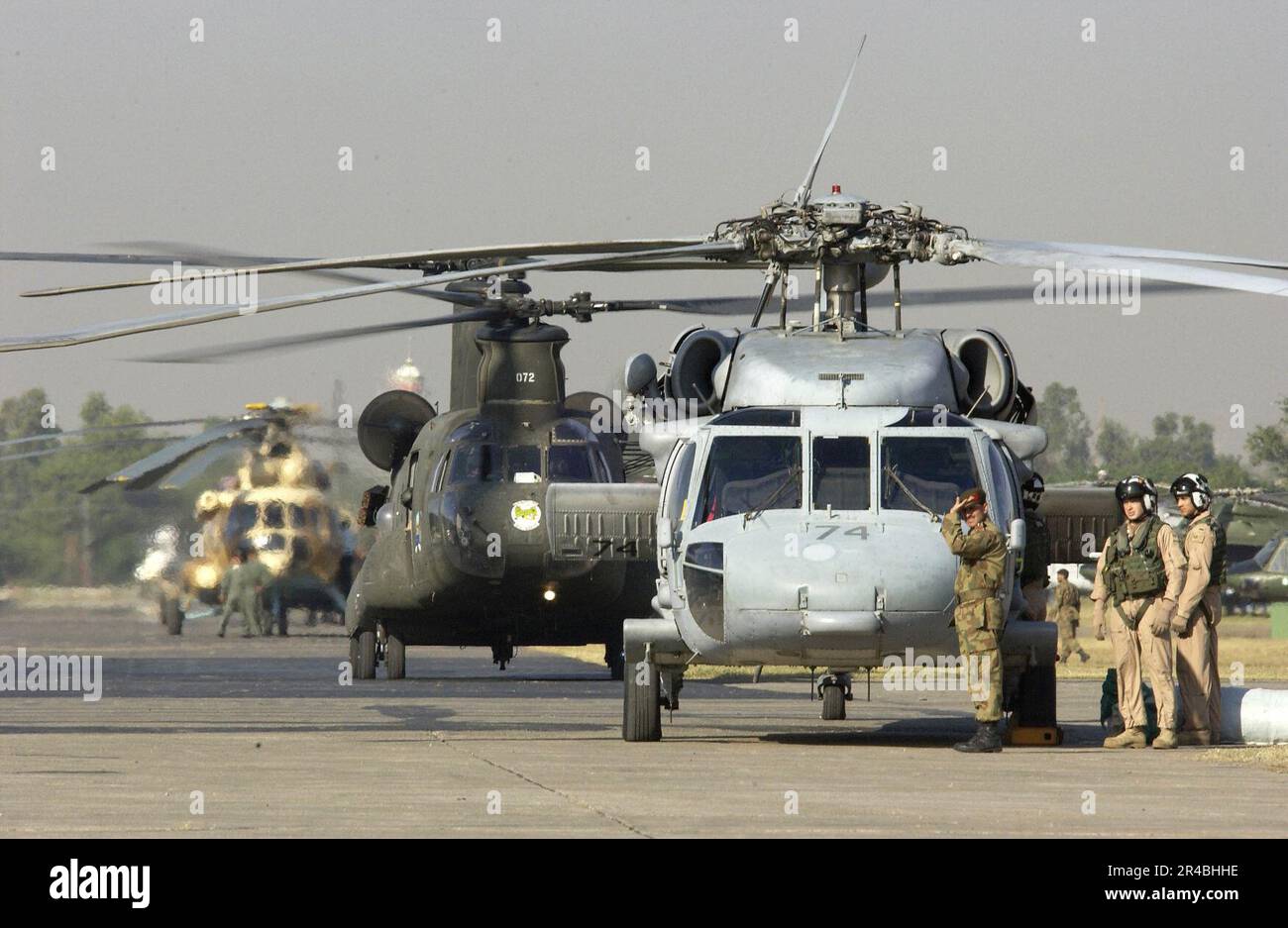 US Navy A U.S. Navy SH-60 Sea Hawk helicopter flight crew waits in line ...