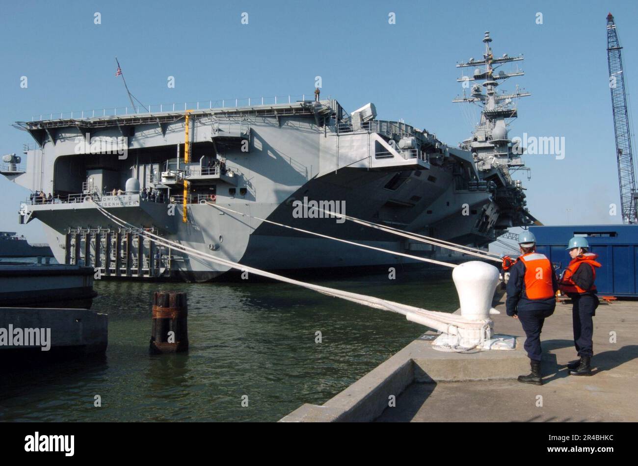 US Navy Line handlers standby as follow Nimitz-class aircraft carrier ...