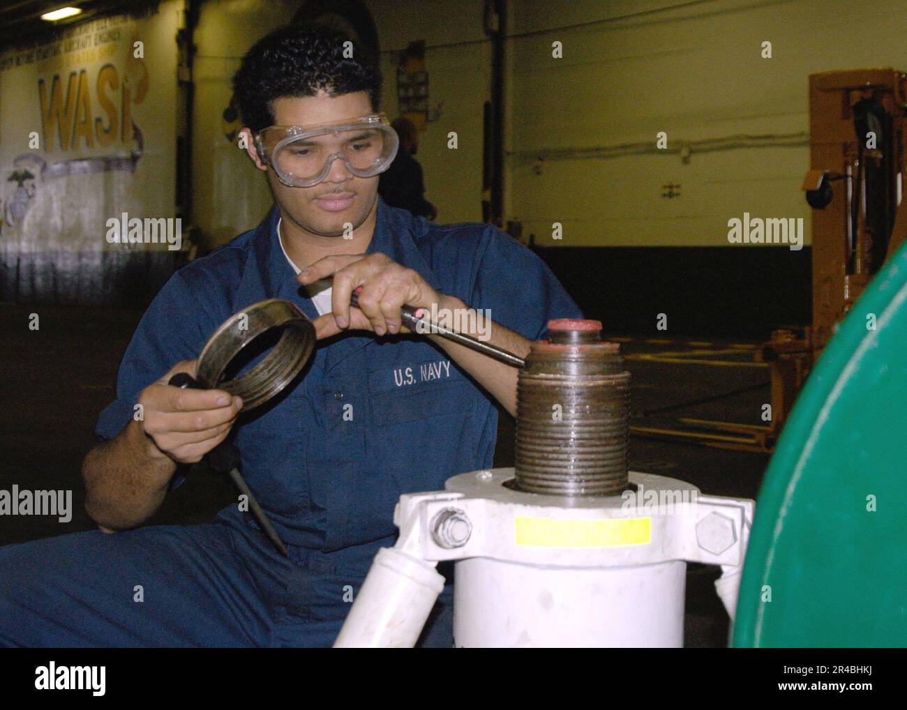 US Navy Aviation Support Equipment Technician Airman makes repairs to ...