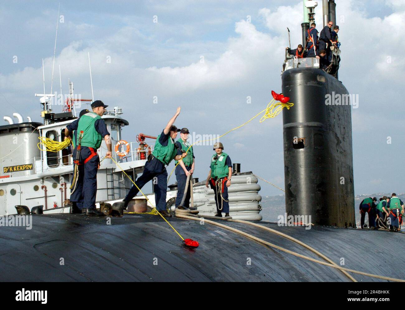 US Navy A Sailor heaves a line ashore as the Los Angeles-class attack ...