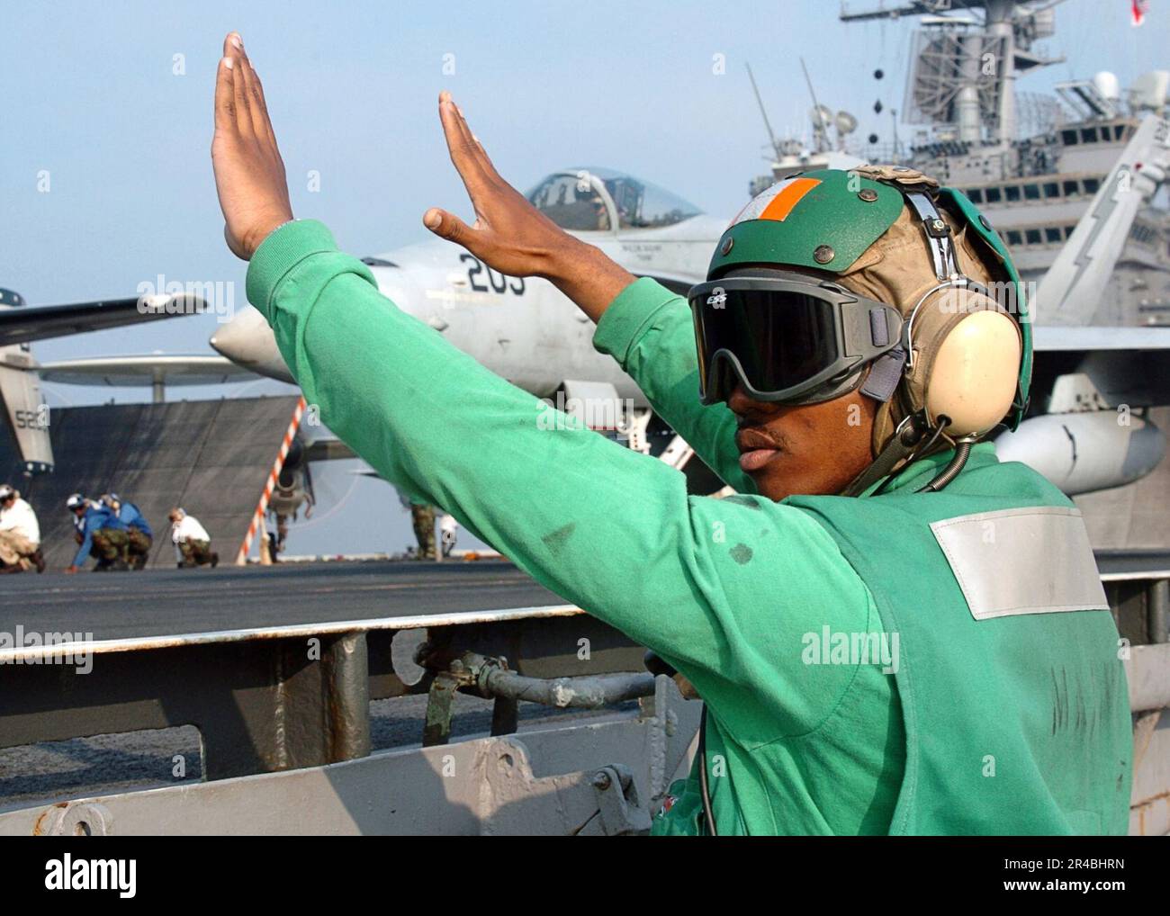 US Navy Aviation Boatswain's Mate 2nd Class gives the ready signal to ...
