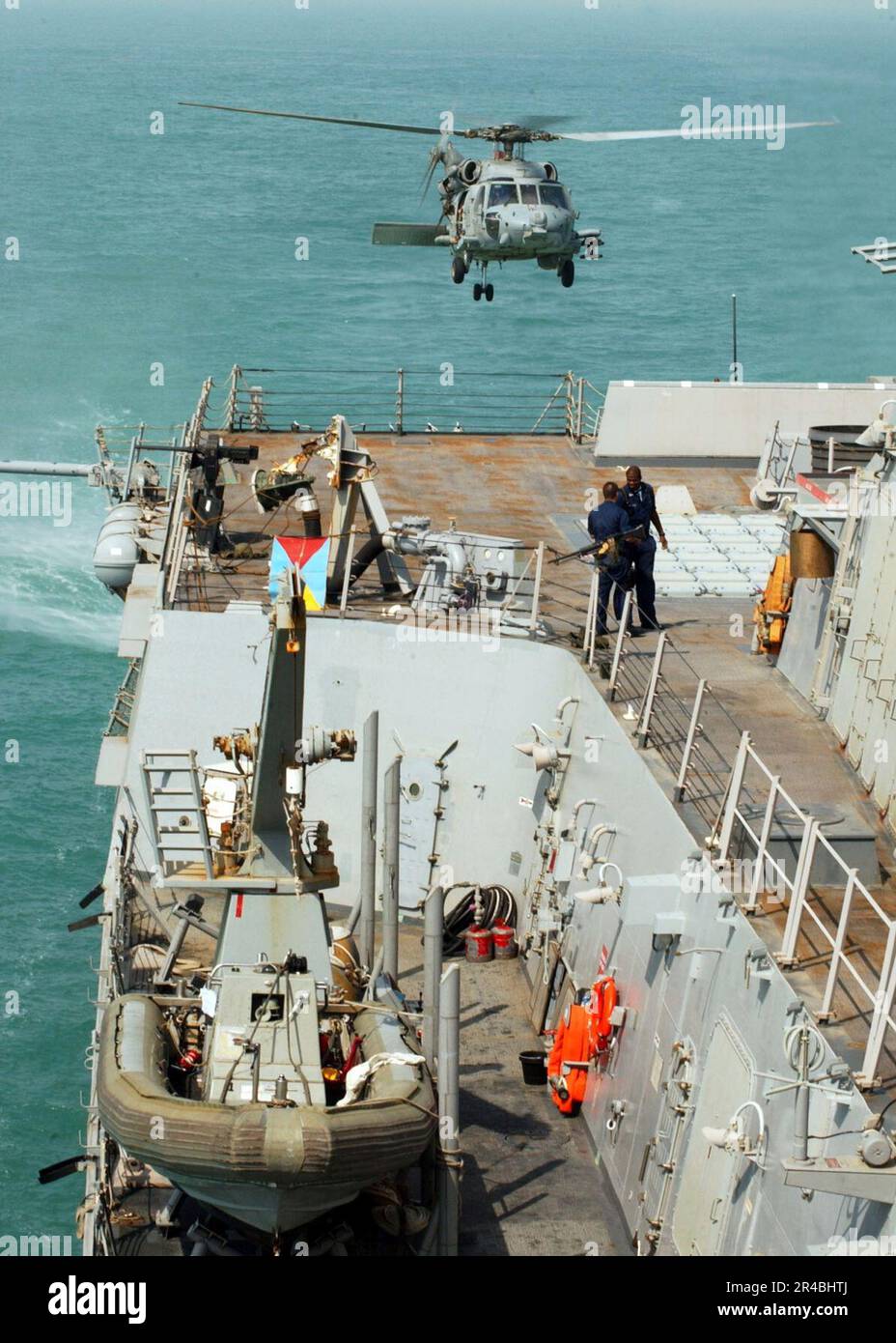 US Navy An HH-60H Seahawk helicopter prepares to land on the flight deck of the Arleigh Burke ...