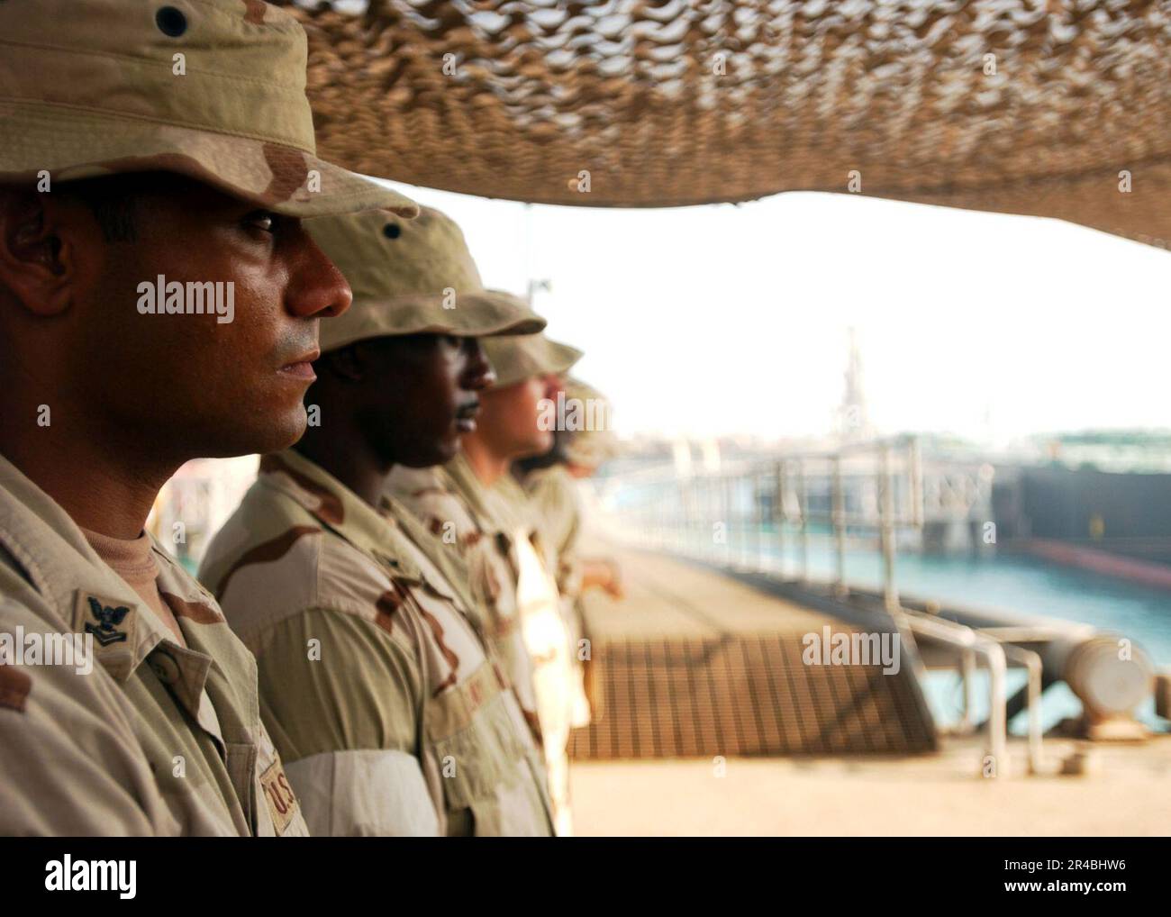 US Navy Sailors stand at attention as Commander, Carrier Strike Group ...