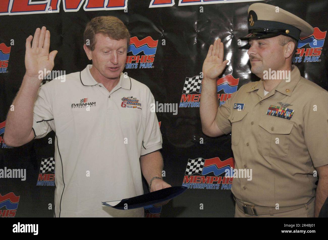 US Navy Chief Aviation Ordnanceman takes the Oath of Enlistment read by ...