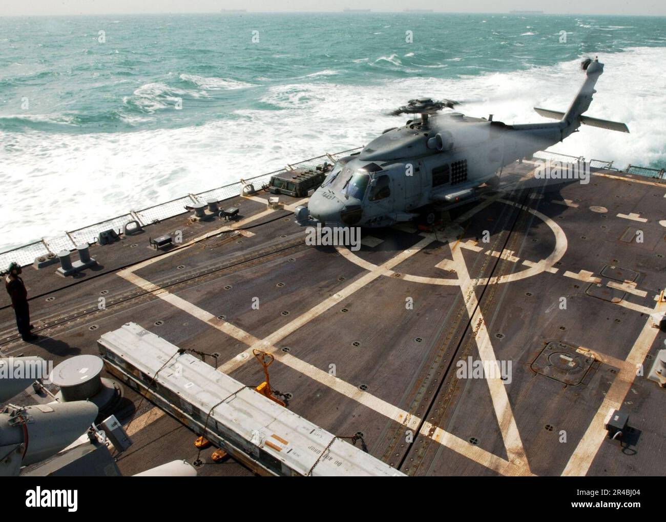 US Navy An SH-60B Seahawk helicopter prepares to take off from the flight deck of the Arleigh ...