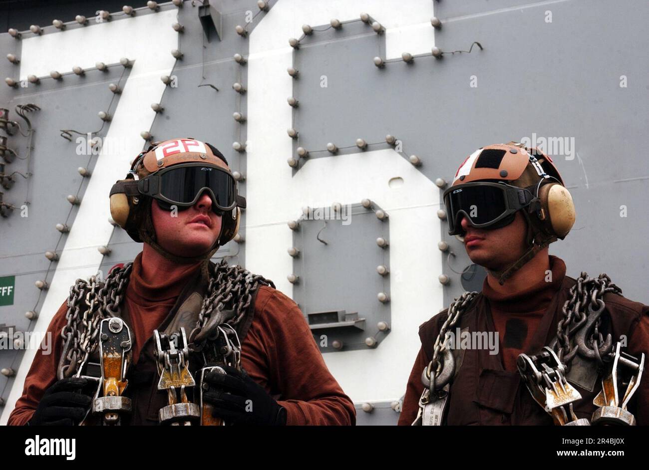 US Navy Squadron plane captains observe flight operations in front of ...