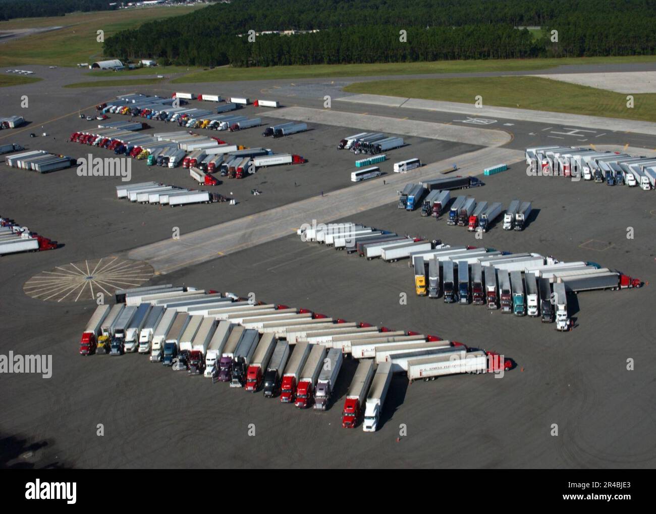 US Navy Tractor trailers loaded with relief supplies from the Federal ...