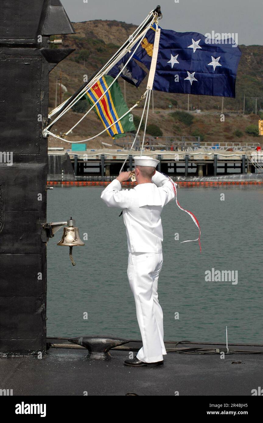 US Navy Electronics Technician 2nd Class hauls down the commissioning ...
