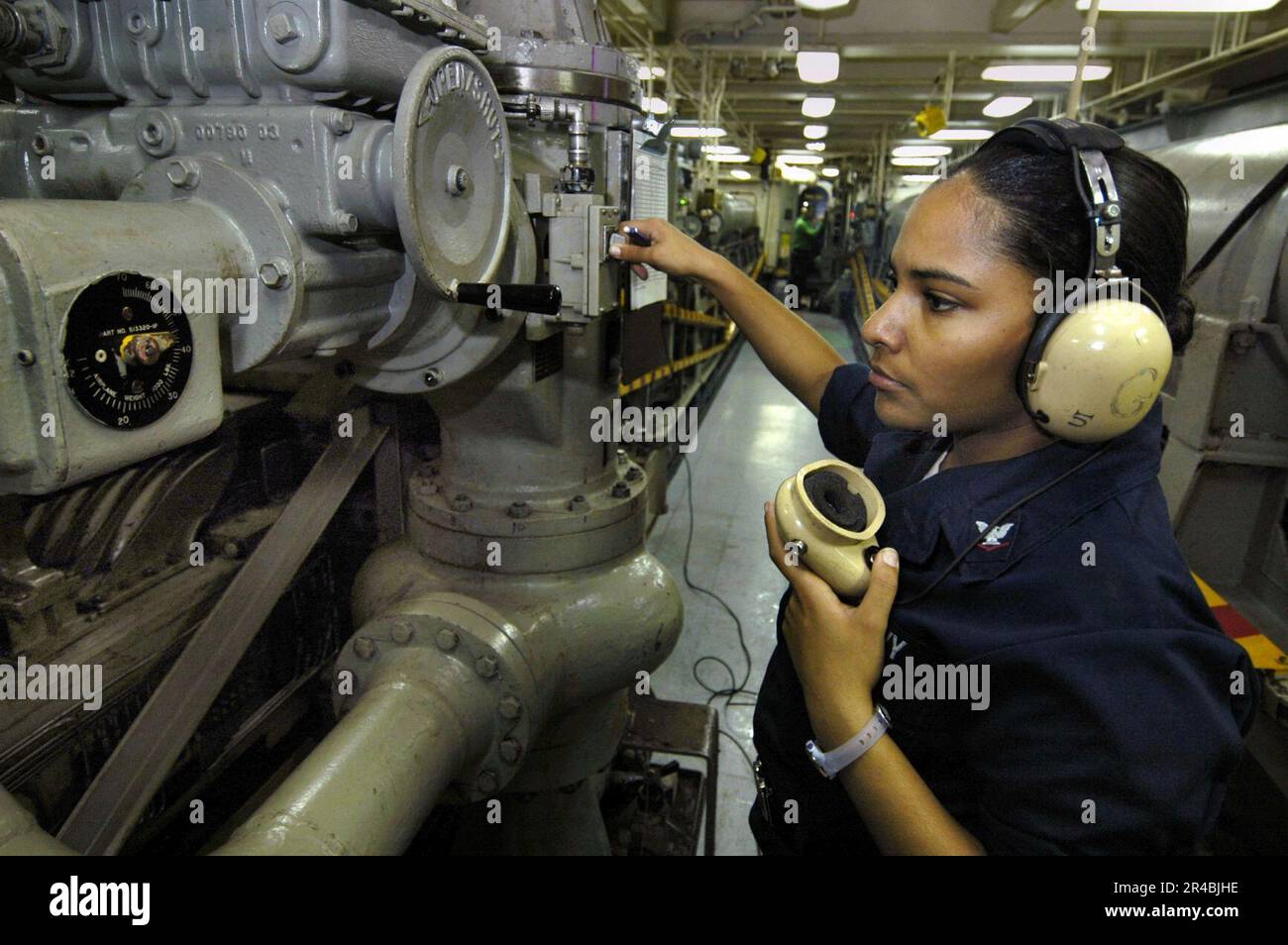 US Navy Aviation Boatswain's Mate 3rd Class monitors arresting gear ...