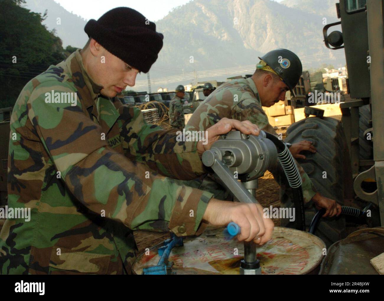 US Navy U.S. Navy Construction Mechanic left, and Equipment Operator ...