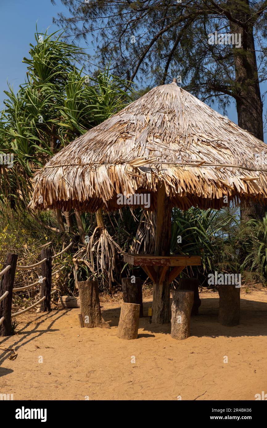 Seating under a wooden hut shelter, located by the sea Stock Photo - Alamy