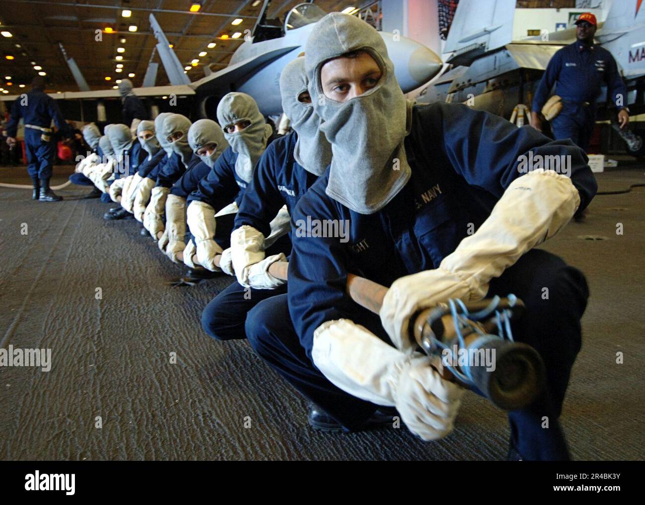 US Navy Sailors assigned to Repair Locker One Bravo stand ready to ...