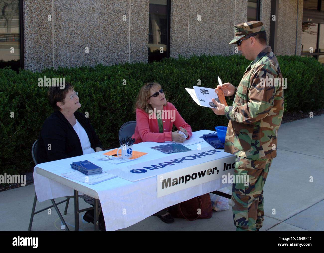 US Navy Chief assigned to Naval Mobile Construction Battalion Seven (NMCB-7), speaks with ...
