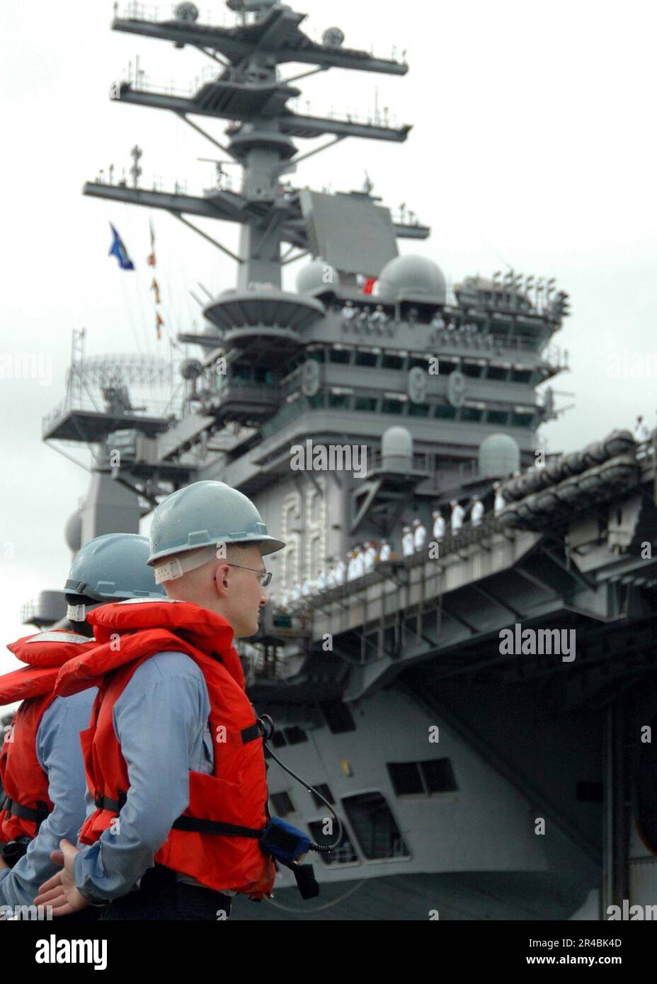 US Navy Line handlers assigned to Naval Station Pearl Harbor standby to ...