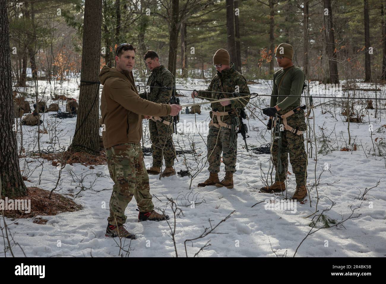 U.S. Army Capt. Ian Brambs (left), commander of Light Fighter School ...