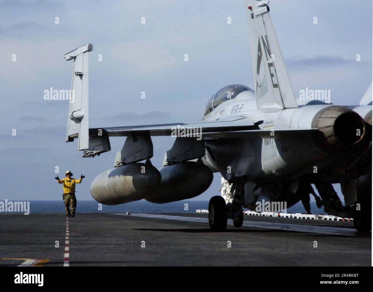 US Navy A plane director guides an F-A-18F Super Hornet Stock Photo - Alamy