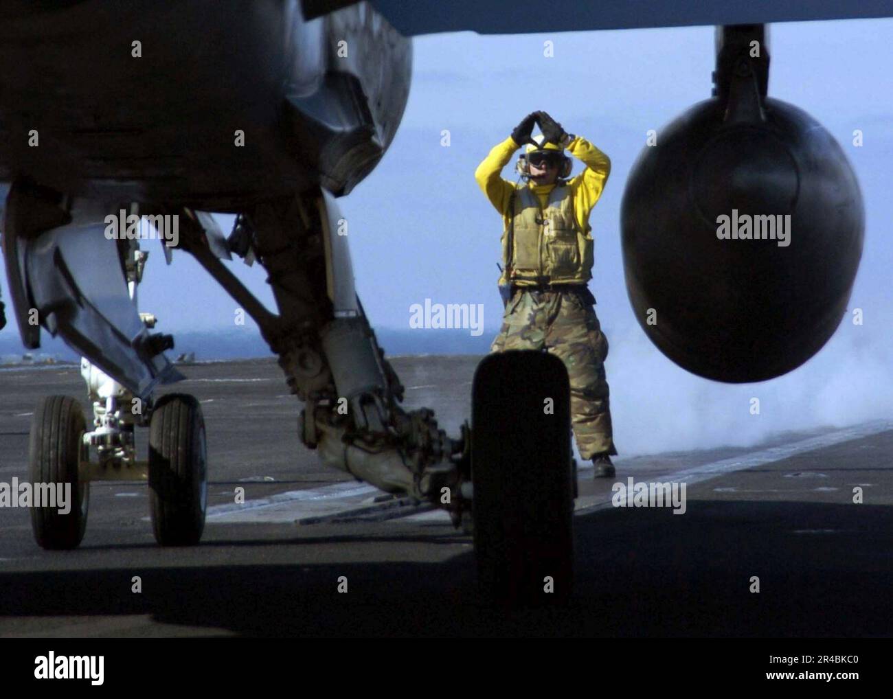 US Navy A plane director guides an F-A-18F Super Hornet Stock Photo - Alamy