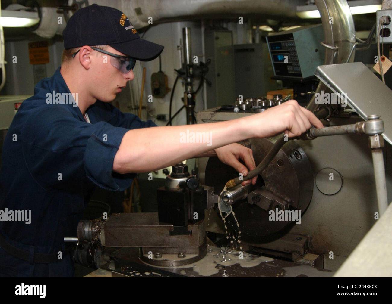 US Navy Fireman Recruit works on an Acme Nut Engine Lay in the repair ...