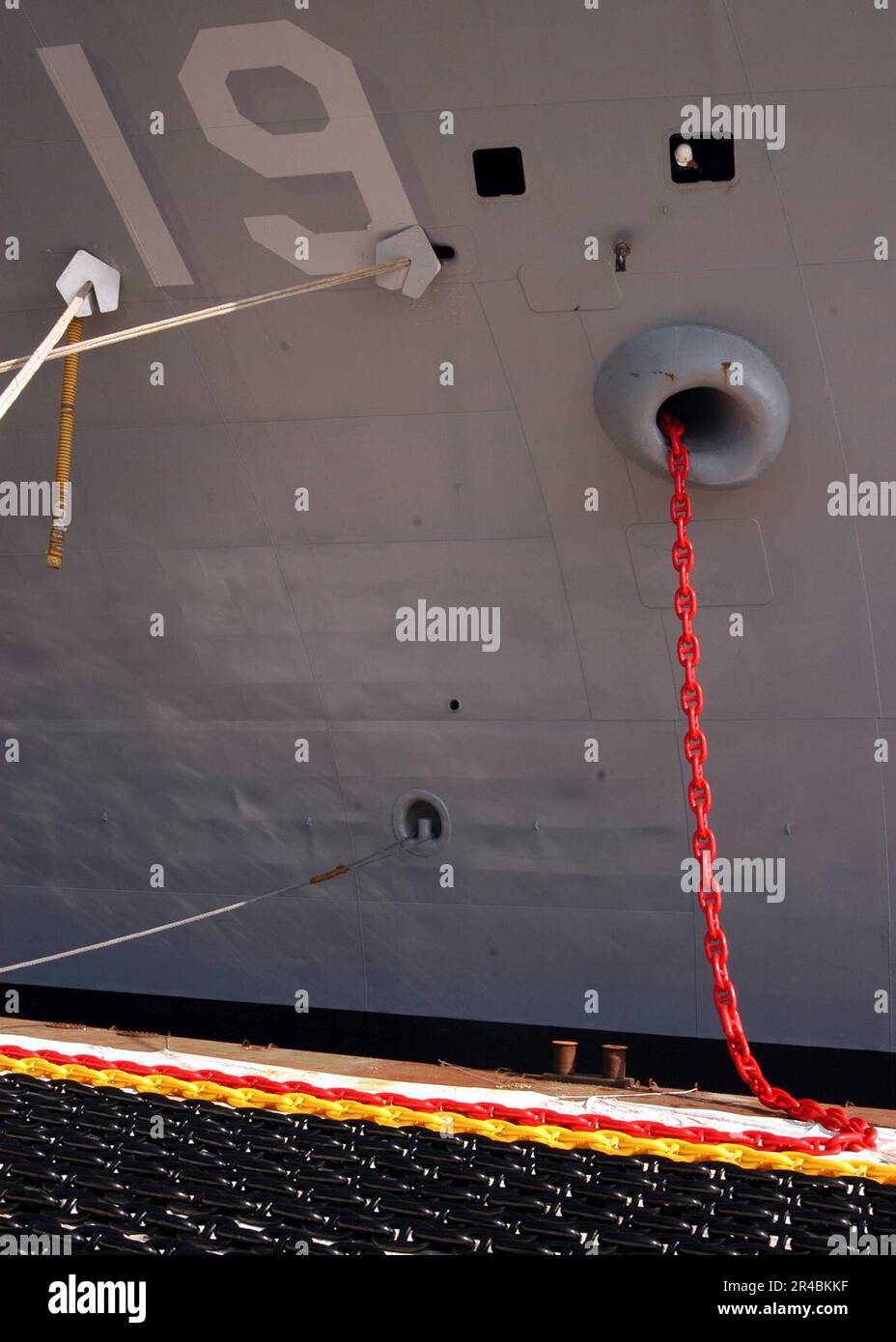 US Navy A new-12-shot anchor chain is hauled aboard the command ship ...