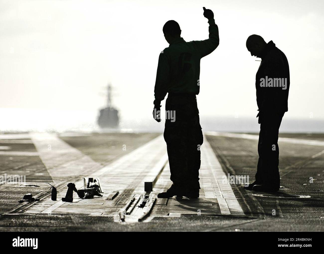 US Navy Air Department personnel give the thumbs up to retract the ...