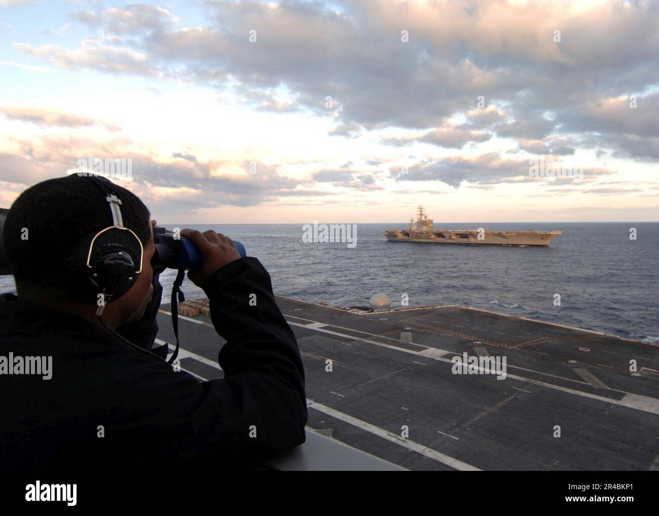 US Navy A Sailor looks at the Nimitz-class aircraft carrier USS Dwight ...