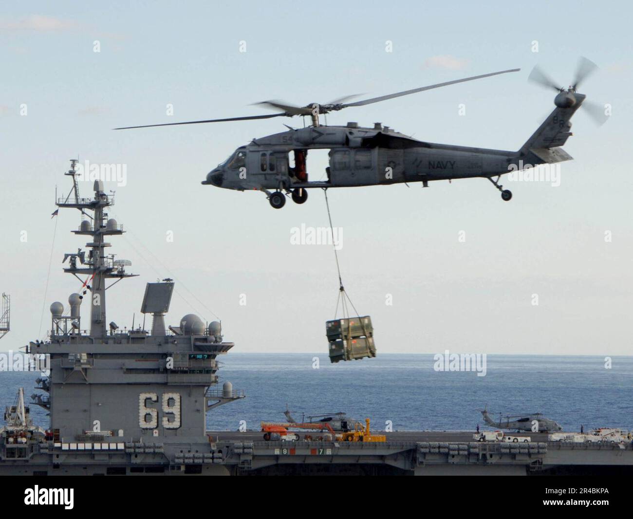 US Navy An MH-60S Seahawk helicopter approaches the flight deck of the ...