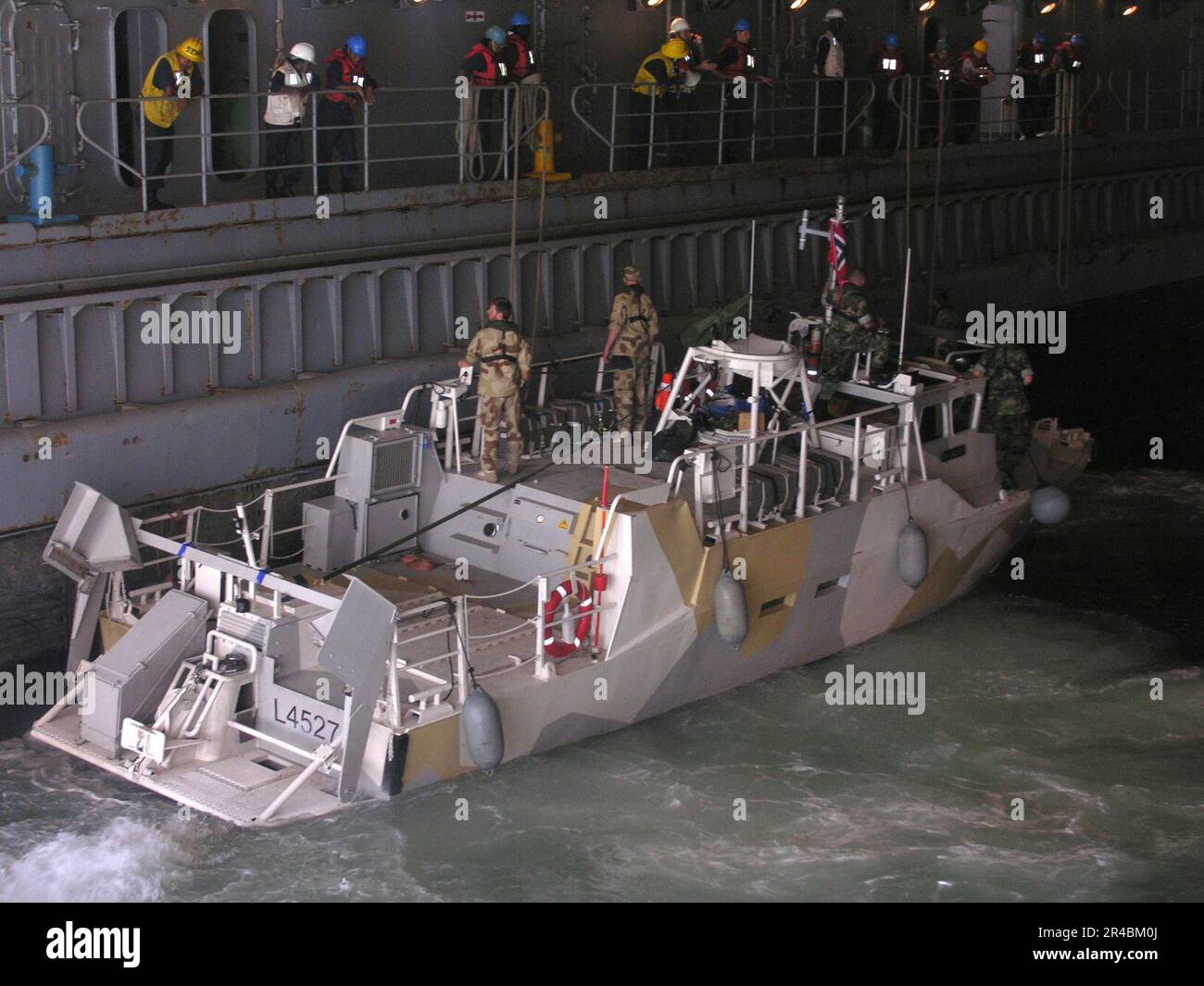 US Navy A Norwegian patrol craft prepares to moor in the well deck ...