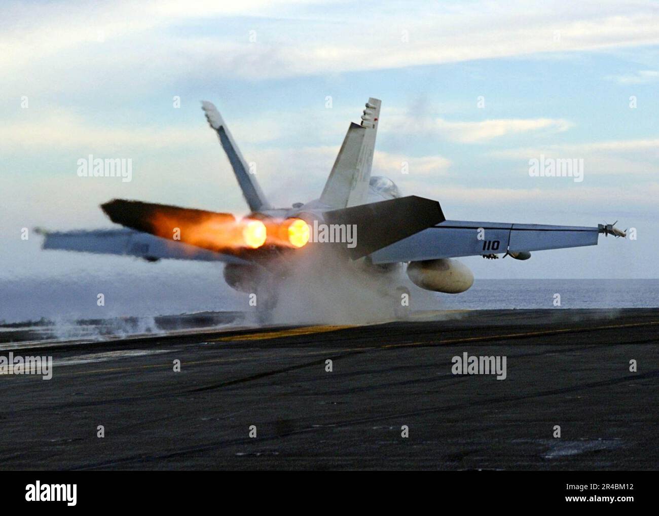 US Navy An F-A-18F Super Hornet launches in full afterburner from the ...