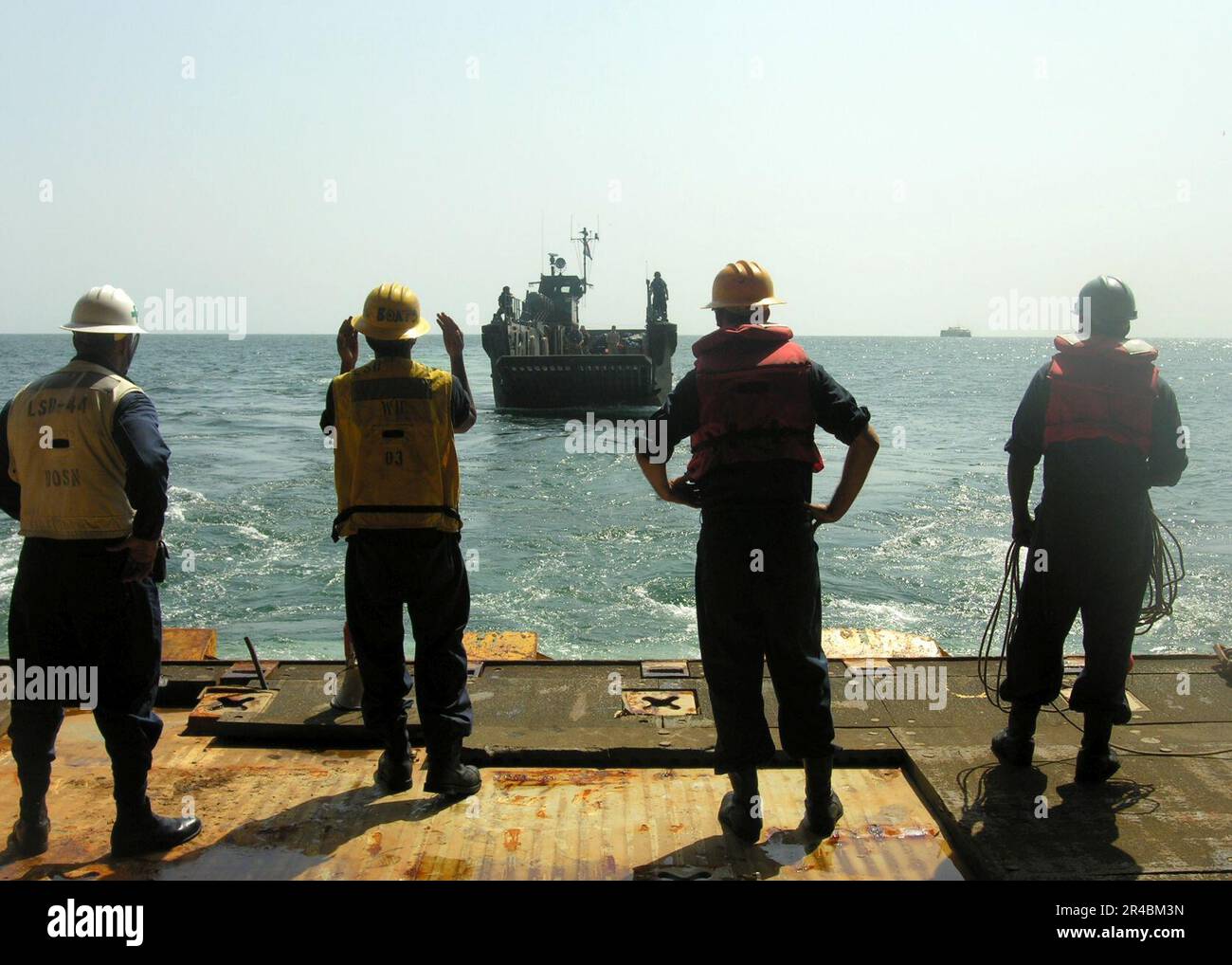 US Navy Deck Department personnel aboard the dock landing ship USS ...