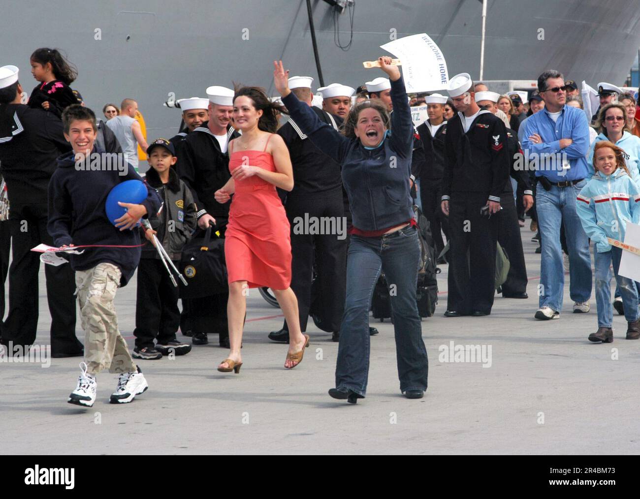 US Navy Friends and family welcome home Sailors assigned to the guided ...