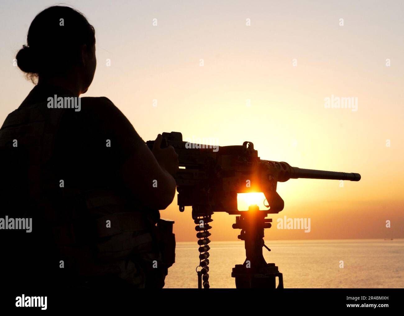 US Navy A U.S. Navy Sailor mans a .50 caliber machine gun mount on the ...