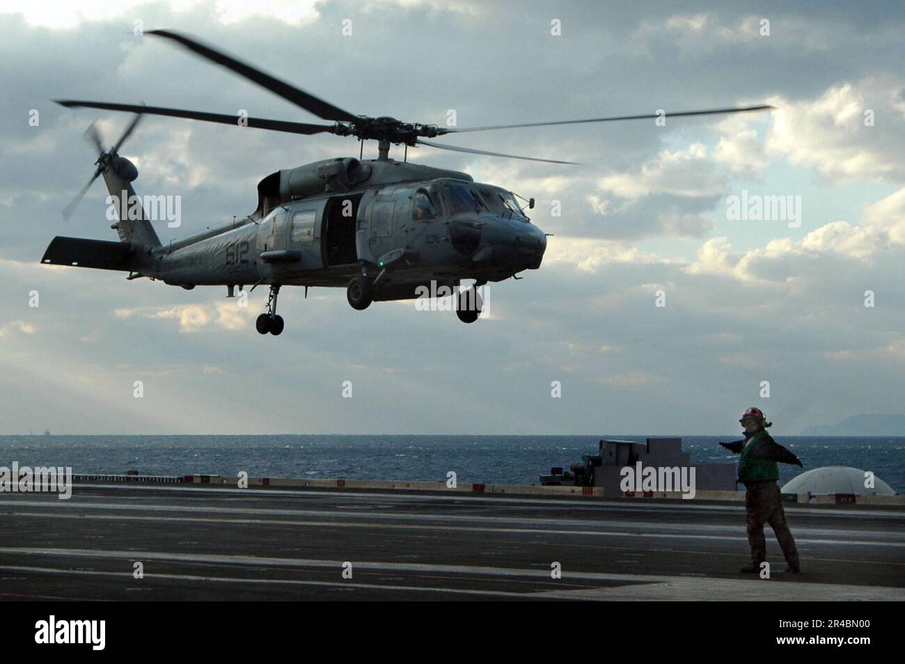 US Navy An SH-60F Seahawk helicopter, assigned to Helicopter Anti-Submarine Squadron Fourteen ...