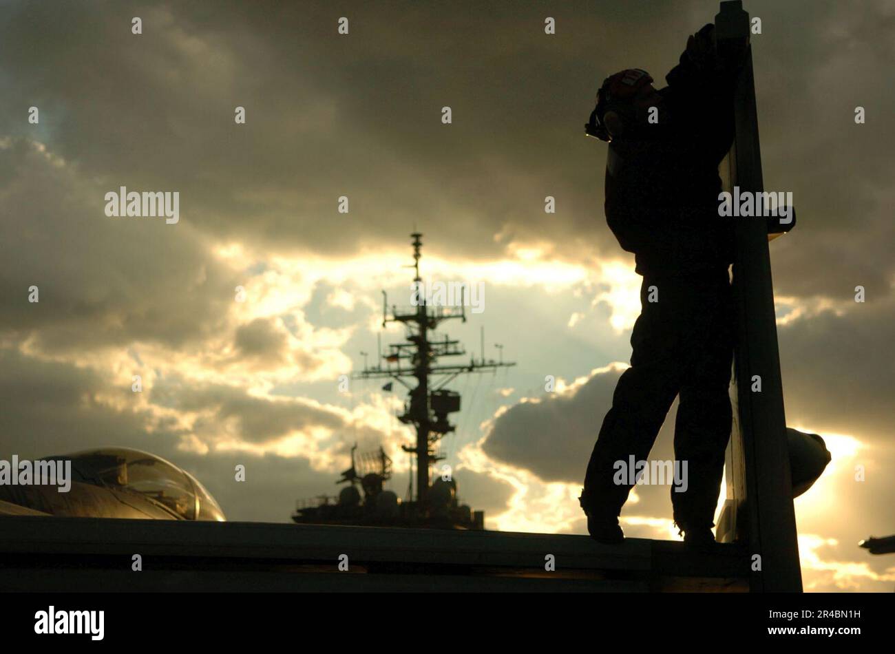 US Navy Aviation Ordnanceman 3rd Class performs maintenance on a LAU ...