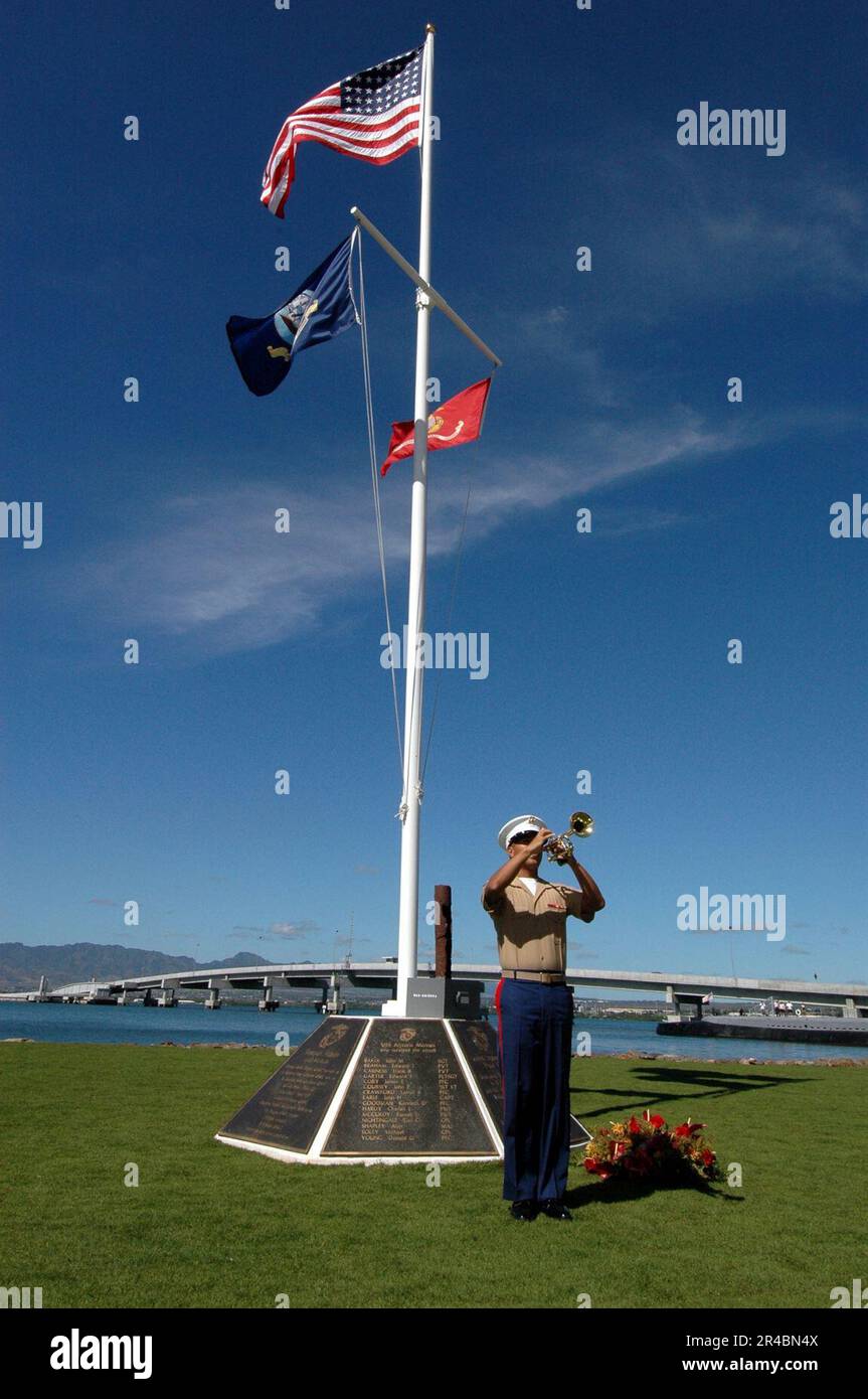 US Navy U.S. Marine Corps Sgt. echoes taps on his bugle during a ...