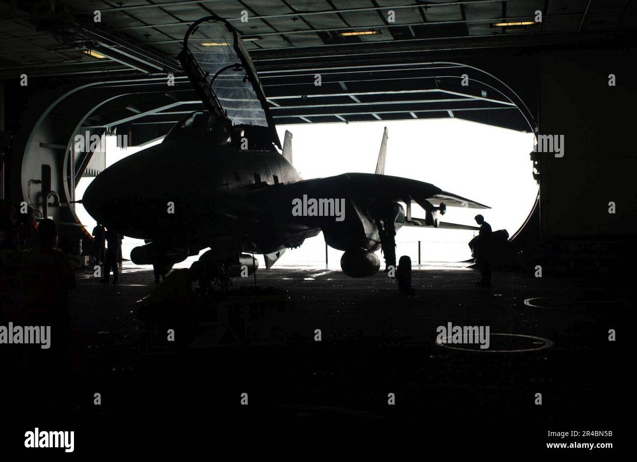 US Navy An F-14D Tomcat is maneuvered in the hangar bay of the Nimitz ...