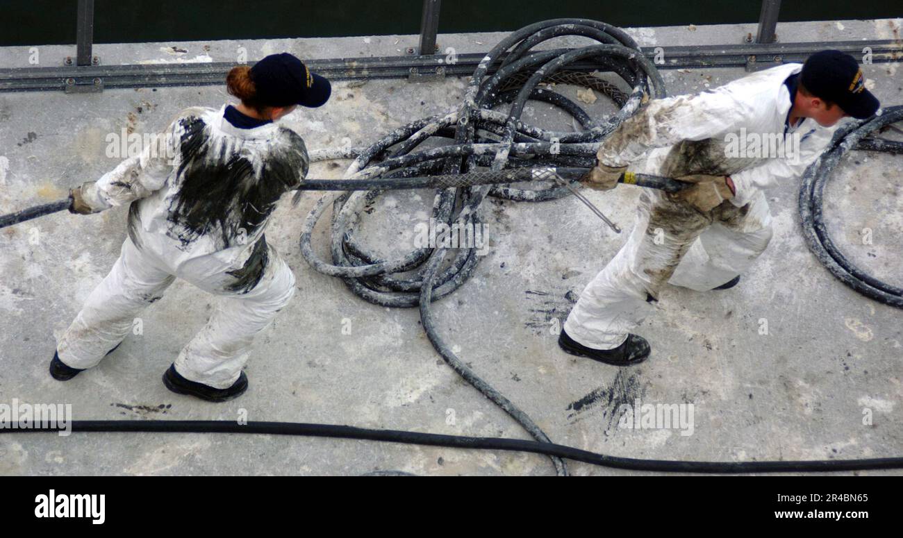 US Navy Sailors assigned to the Nimitz-class aircraft carrier USS Harry ...