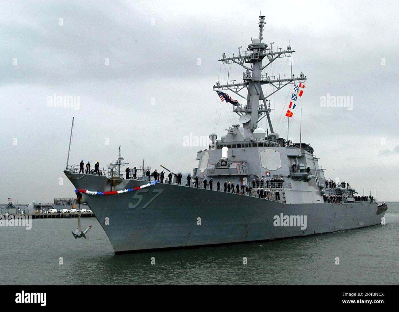 US Navy Sailors man-the rails aboard the guided missile destroyer USS ...