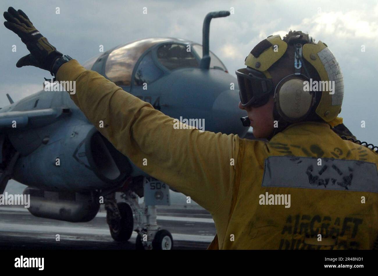 US Navy An Aviation Boatswain's Mate signals an EA-6B Prowler, assigned ...