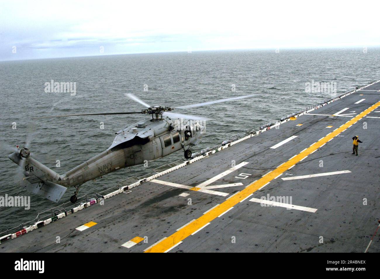 US Navy An MH-60S Seahawk helicopter, assigned to the Bay Raiders of ...