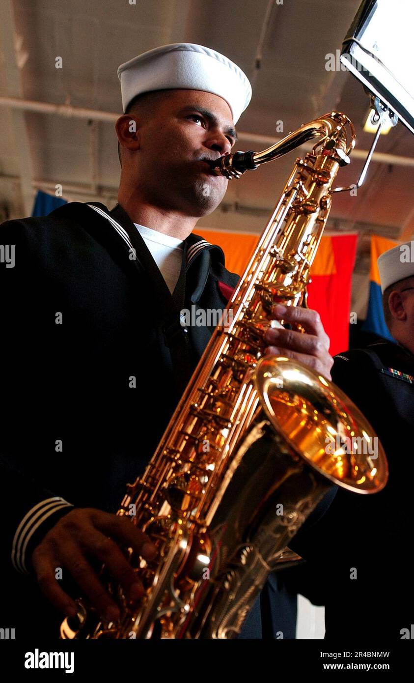 US Navy A member of Navy Band Southwest plays the saxophone during a ...