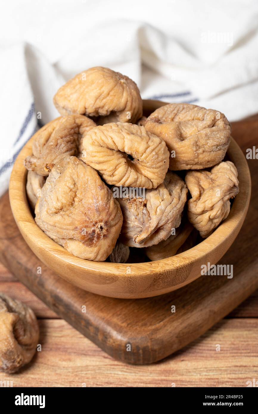 Dried figs in bowl. Organic farm products. Sun-dried figs on dark ...