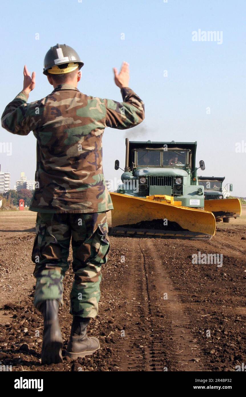 US Navy Engineering Aide 2nd Class assigned to Naval Air Facility ...