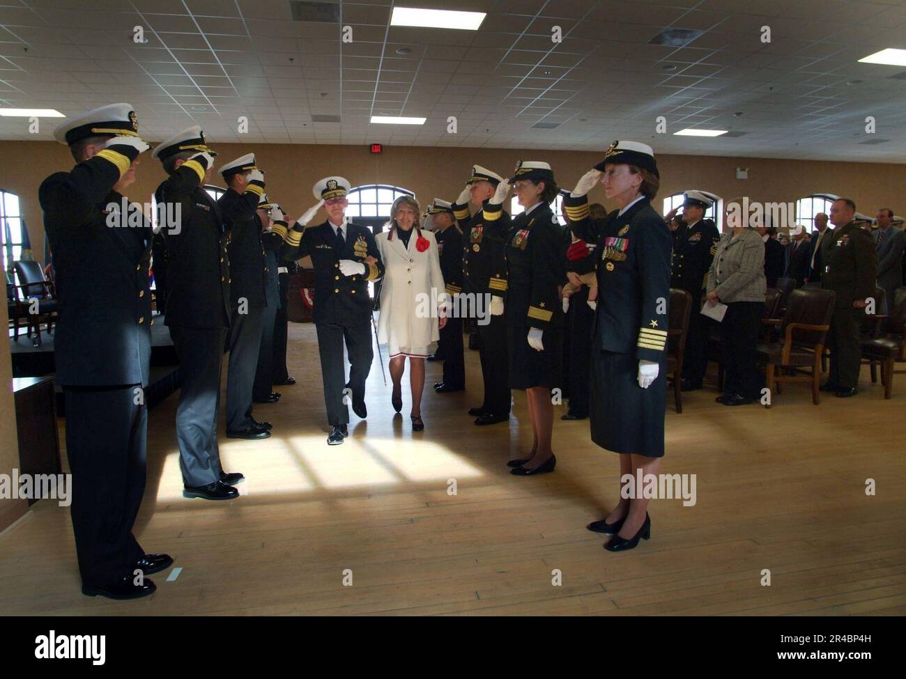 US Navy Vice Adm. Gerry Hoewing and his wife are rendered honors as ...